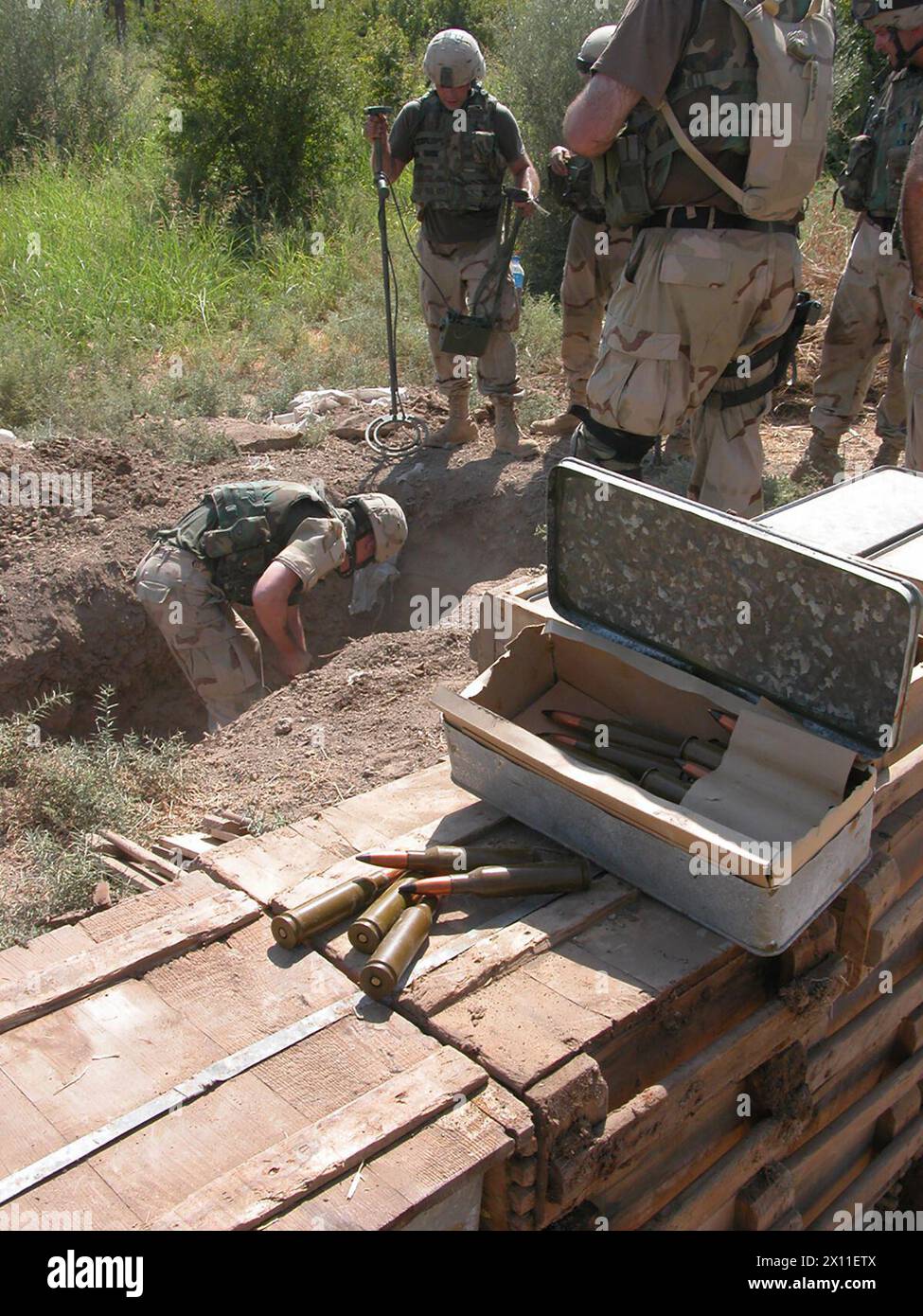 Members of Bravo Company, 2-162, 39th Brigade Combat Team, uncover 38 ...