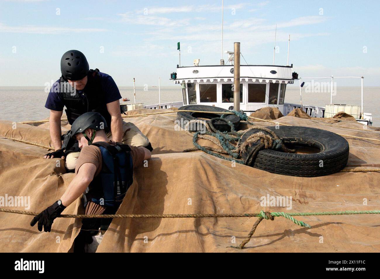 ARABIAN GULF (Jan. 5, 2004)--Members of a boarding team from the U.S ...