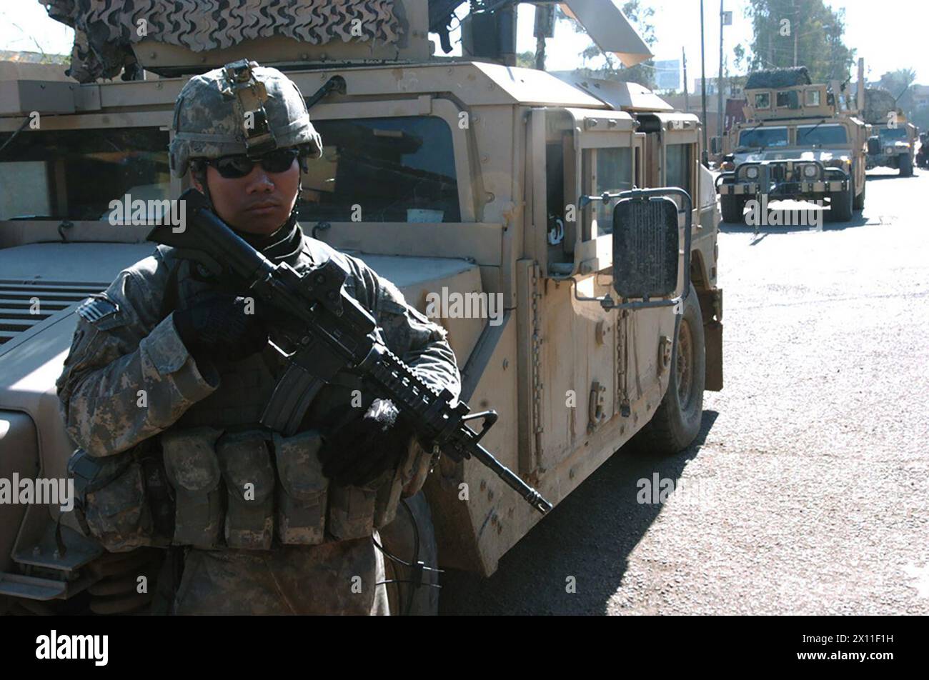 An army specialist with Company A, 1st Battalion, 64th Armor Regiment ...