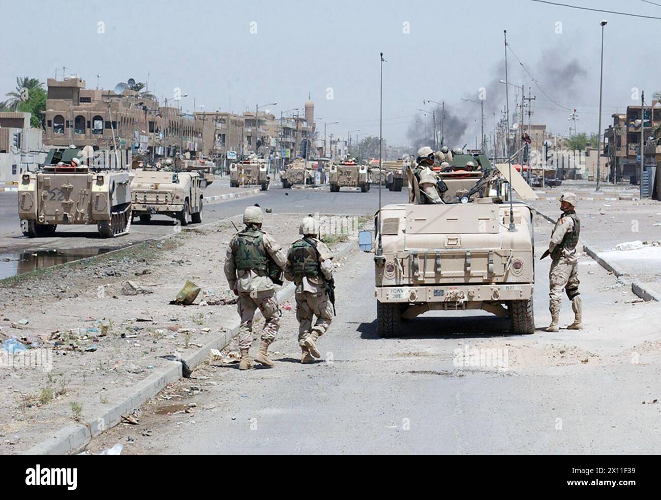 Soldiers and their vehicles assemble along route Delta, located in Sadr ...
