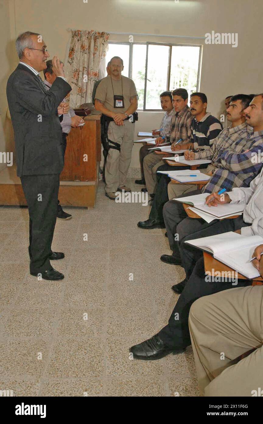 A professor from the Irbil Police Academy teaches a class on law to ...