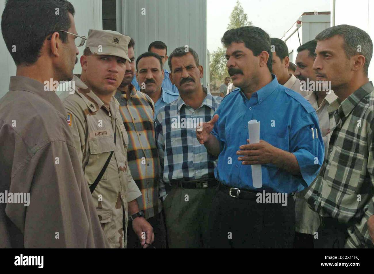 Sgt. Stephen Branstetter, a member of the 416th public safety team, speaks with police officers ...