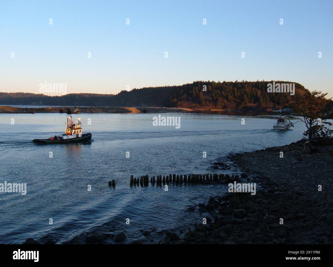 SEATTLE - The tugboat Joe Foss is escorted into the marina at La Push ...