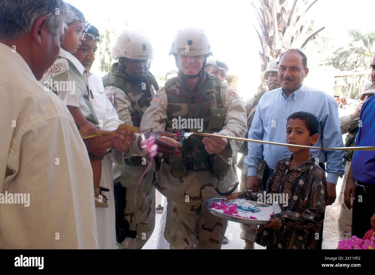 As village leaders look on, Lt. Col. Daniel R. Kestle and Command Sgt ...