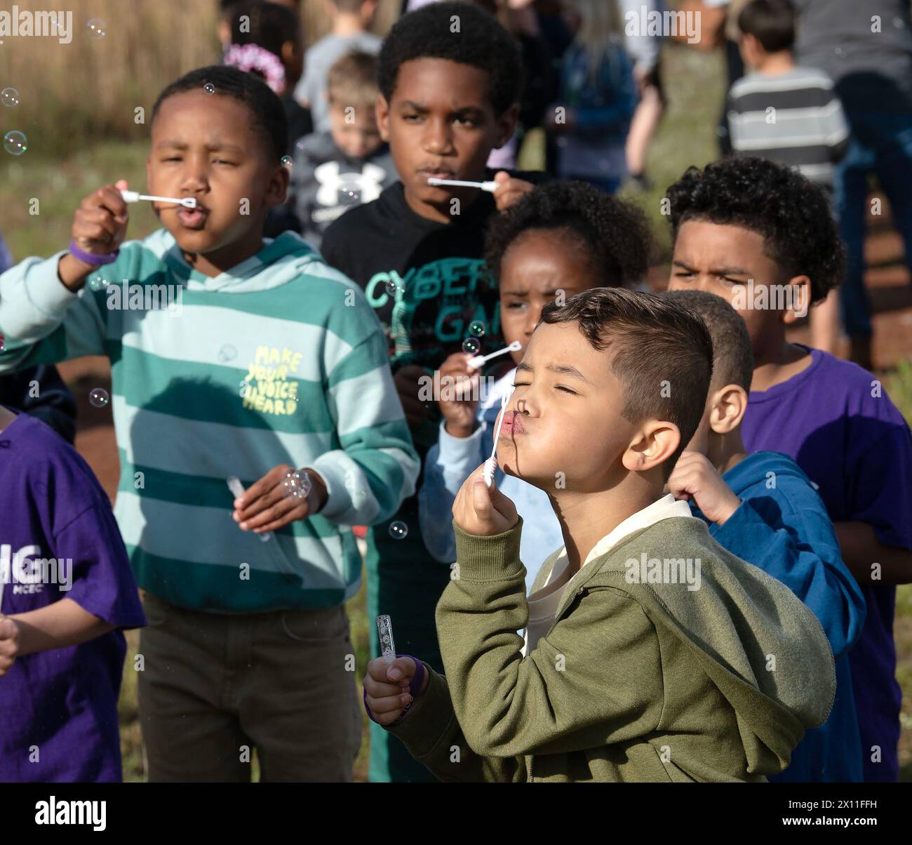 Original Caption: Pierce Terrace Elementary Scchool students blow ...