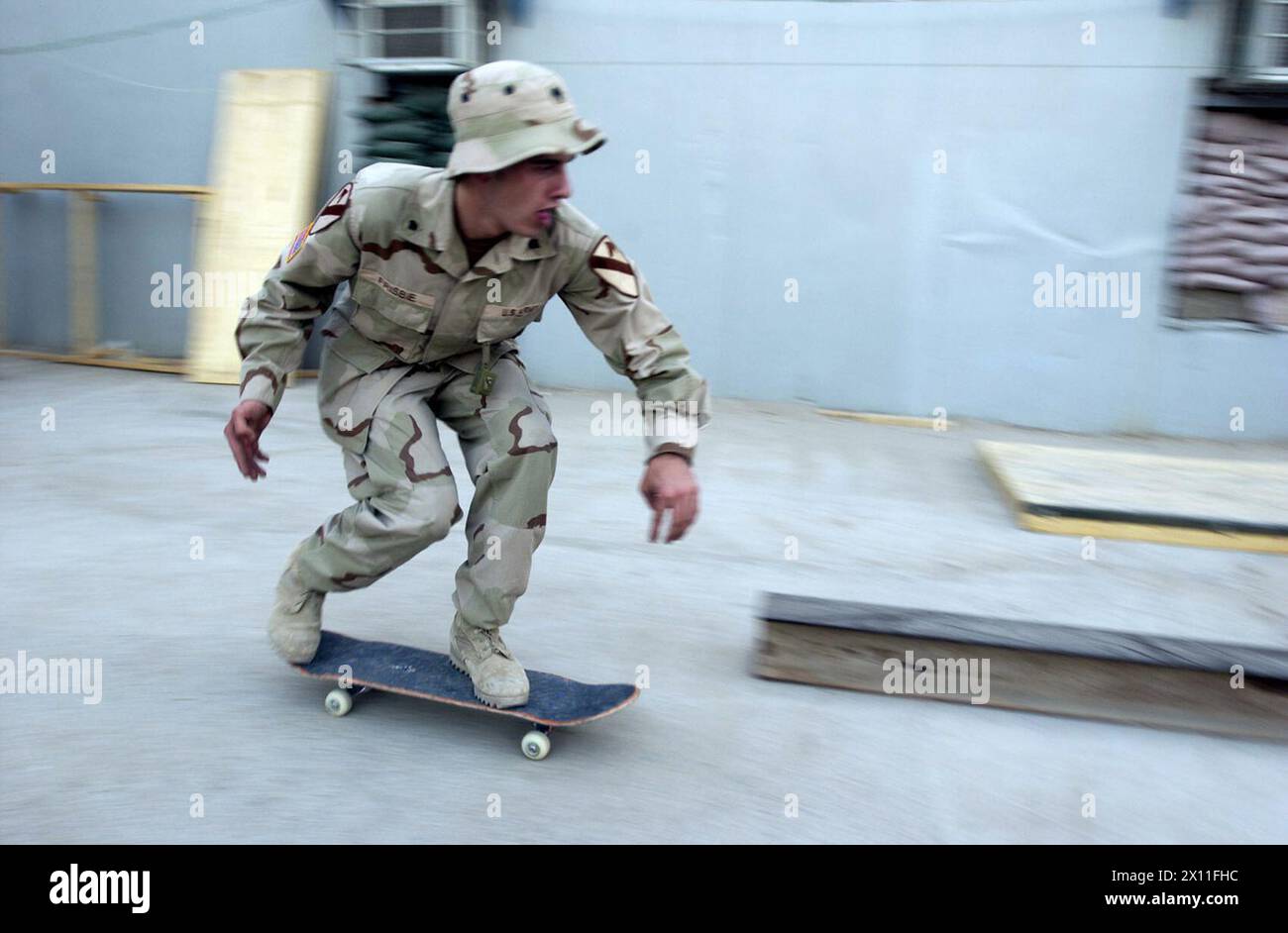 Racing up to an I-beam serving as a grind bar, command post operator ...