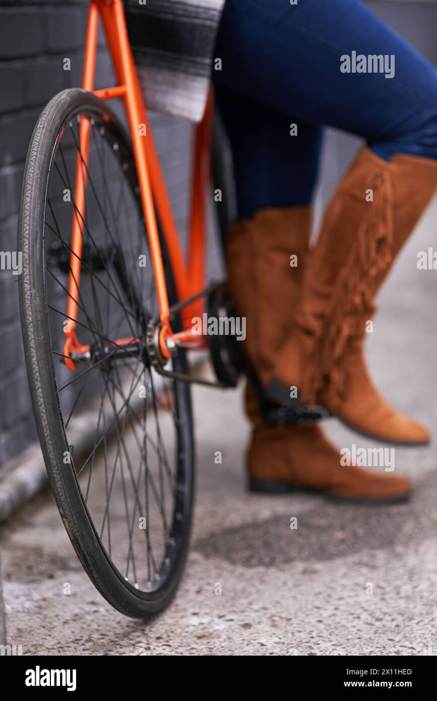 Legs, person and bicycle with standing on a road with morning transport ...