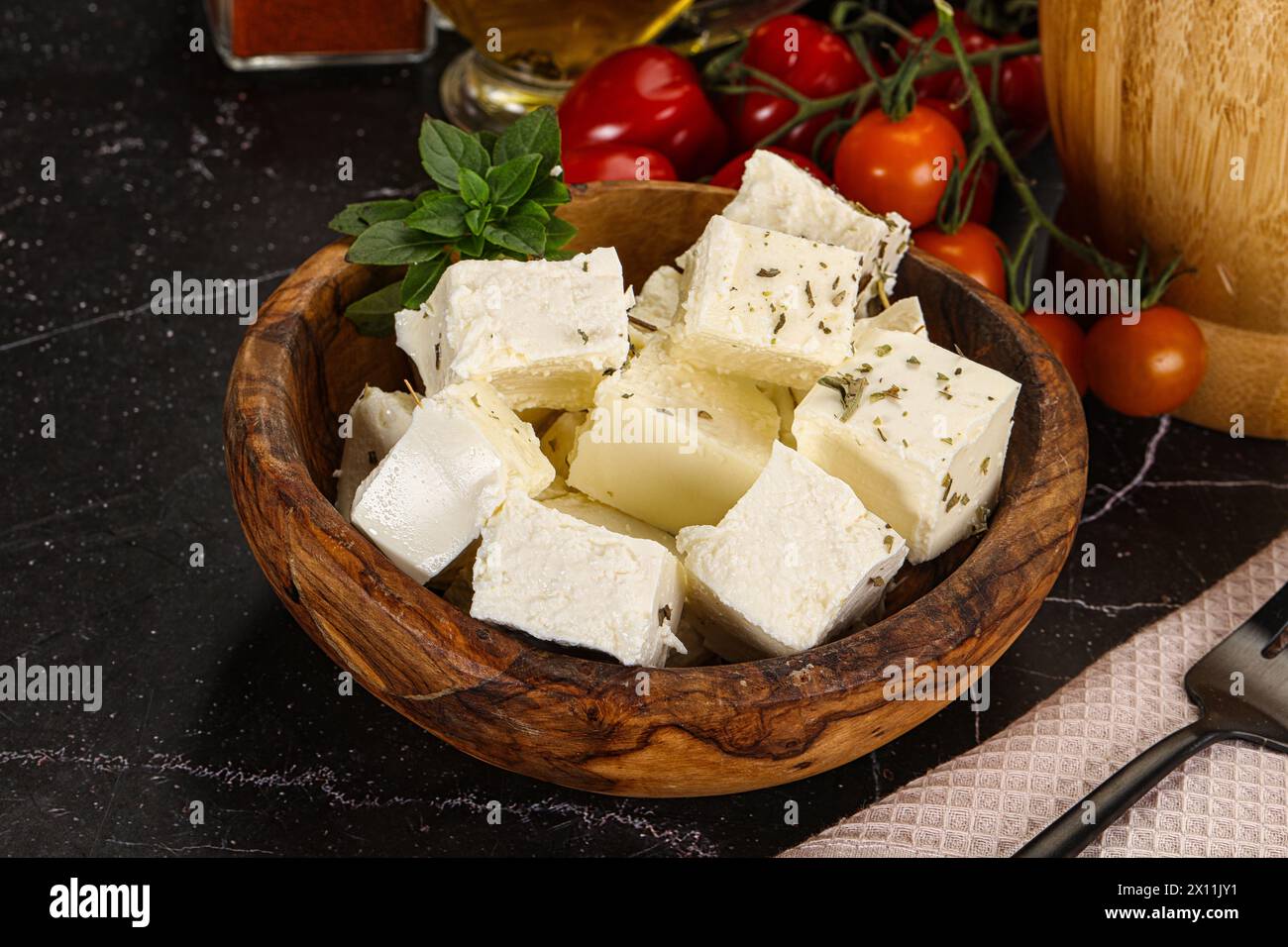 Greek traditional Feta cheese cubes with herbs and spices Stock Photo ...