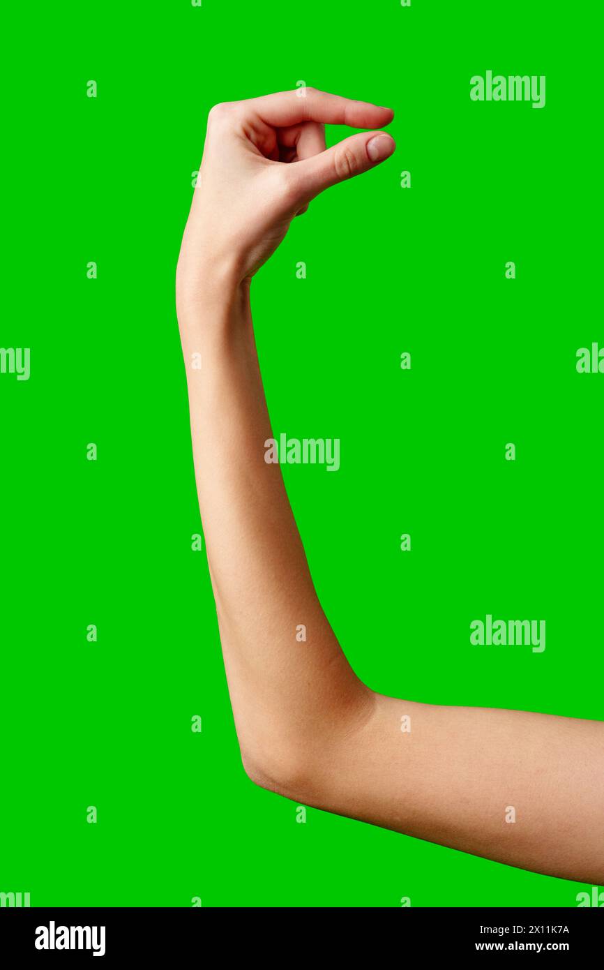 A womans hand extends upward into the air, fingers outstretched ...