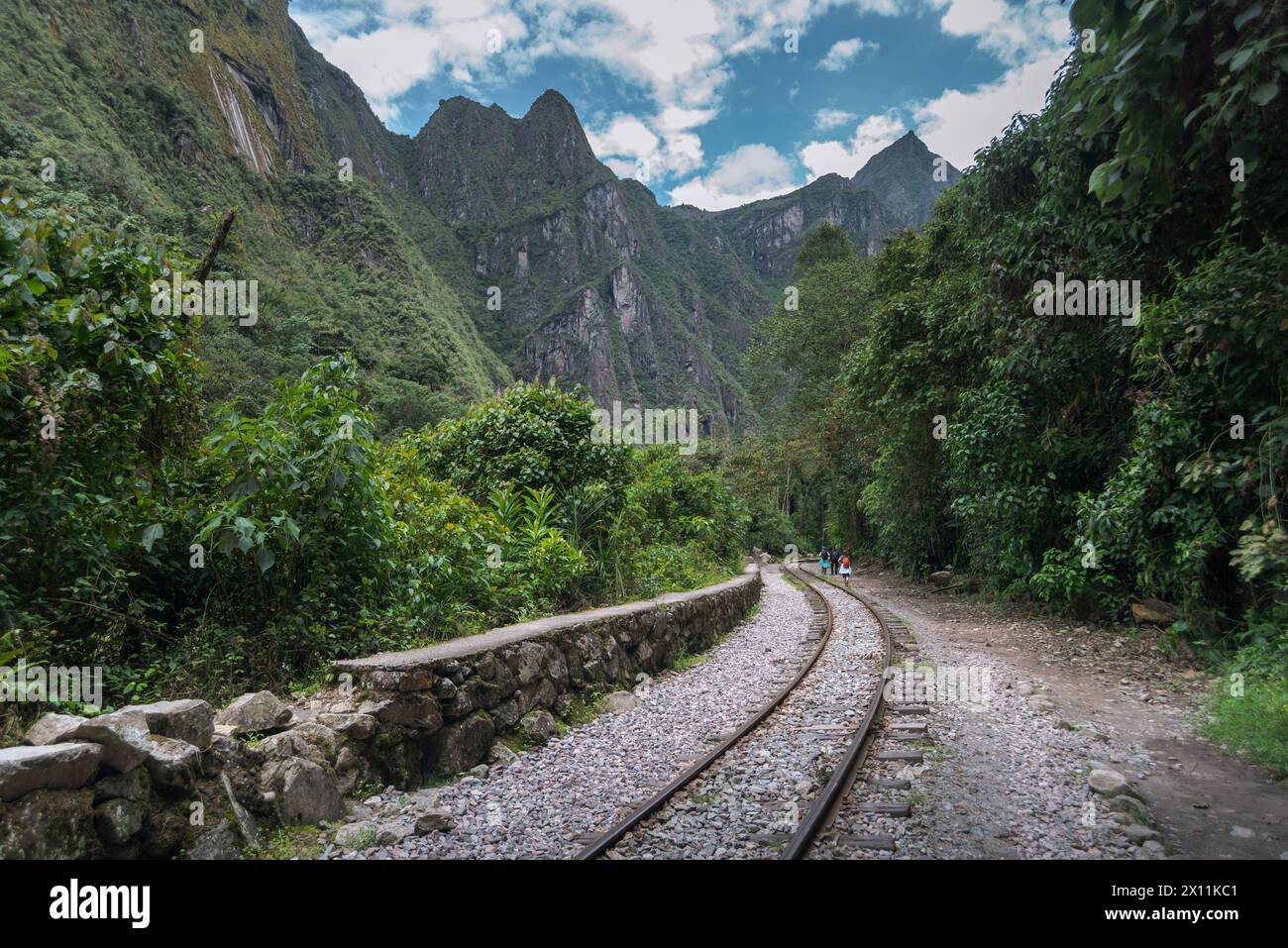 single-track railway in Peruvian Andes with walking tourists Stock ...