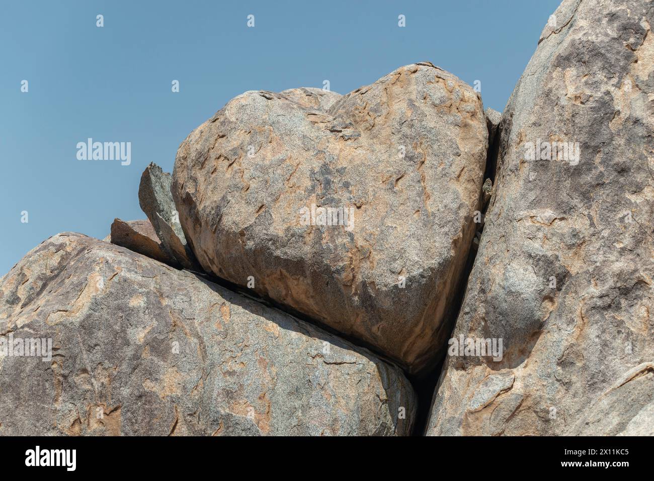 dry weathered rock in shape of heart atop of mountain Stock Photo - Alamy