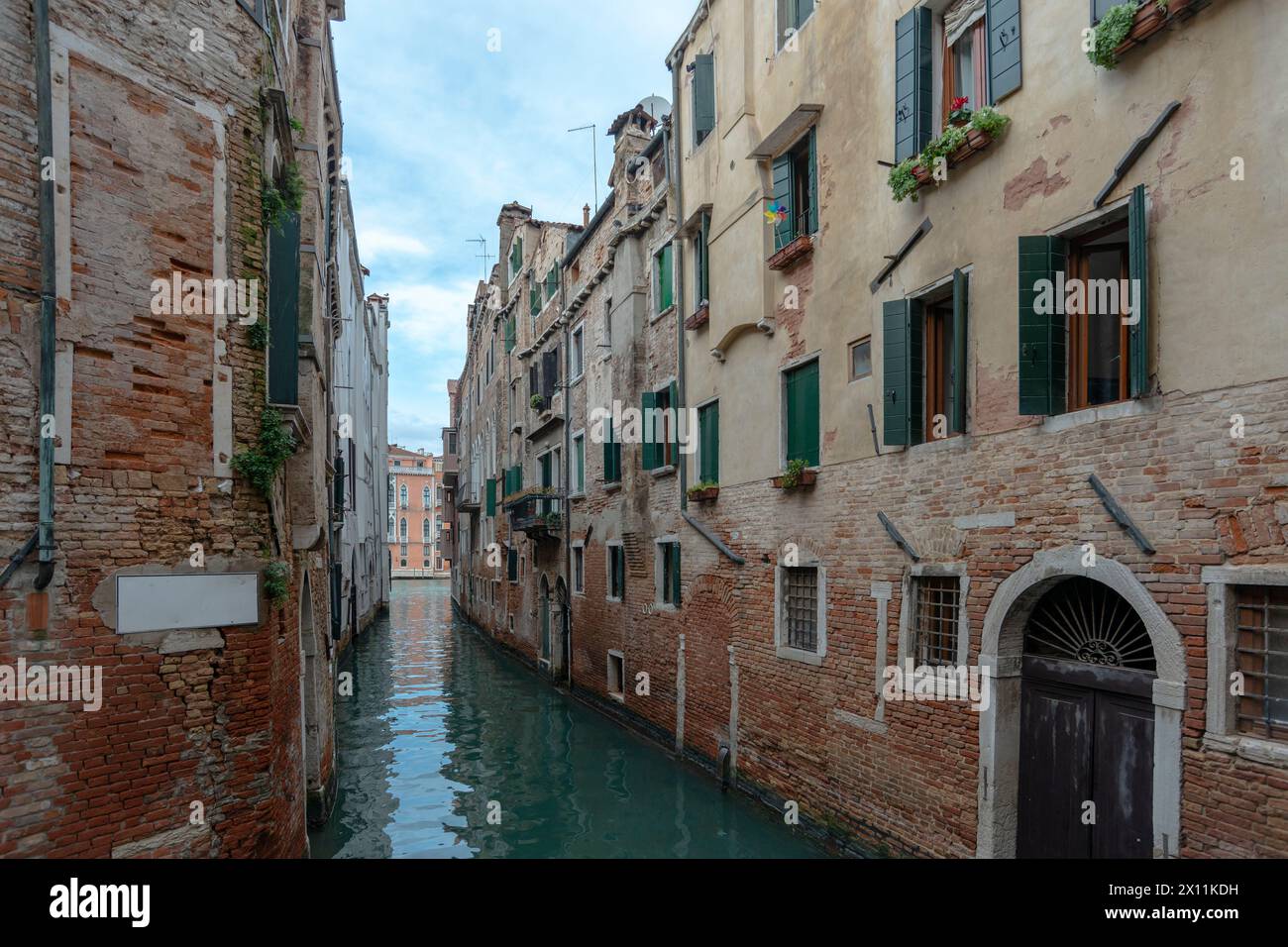 old buildings on water with narrow space between in Venice, Italy Stock ...