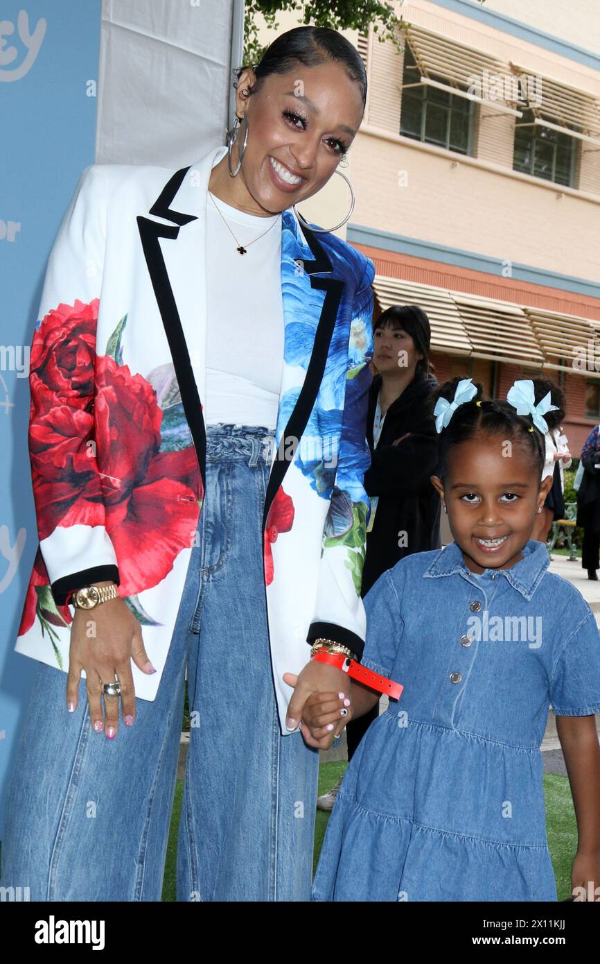 LOS ANGELES - APR 13: Tia Mowry, Cairo Hardrick at the Bluey "The Sign" Movie Premiere at the ...