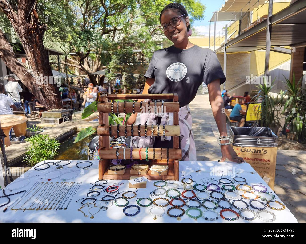 Windhoek, Namibia. 14th Apr, 2024. A vendor stands at her stall at the ...
