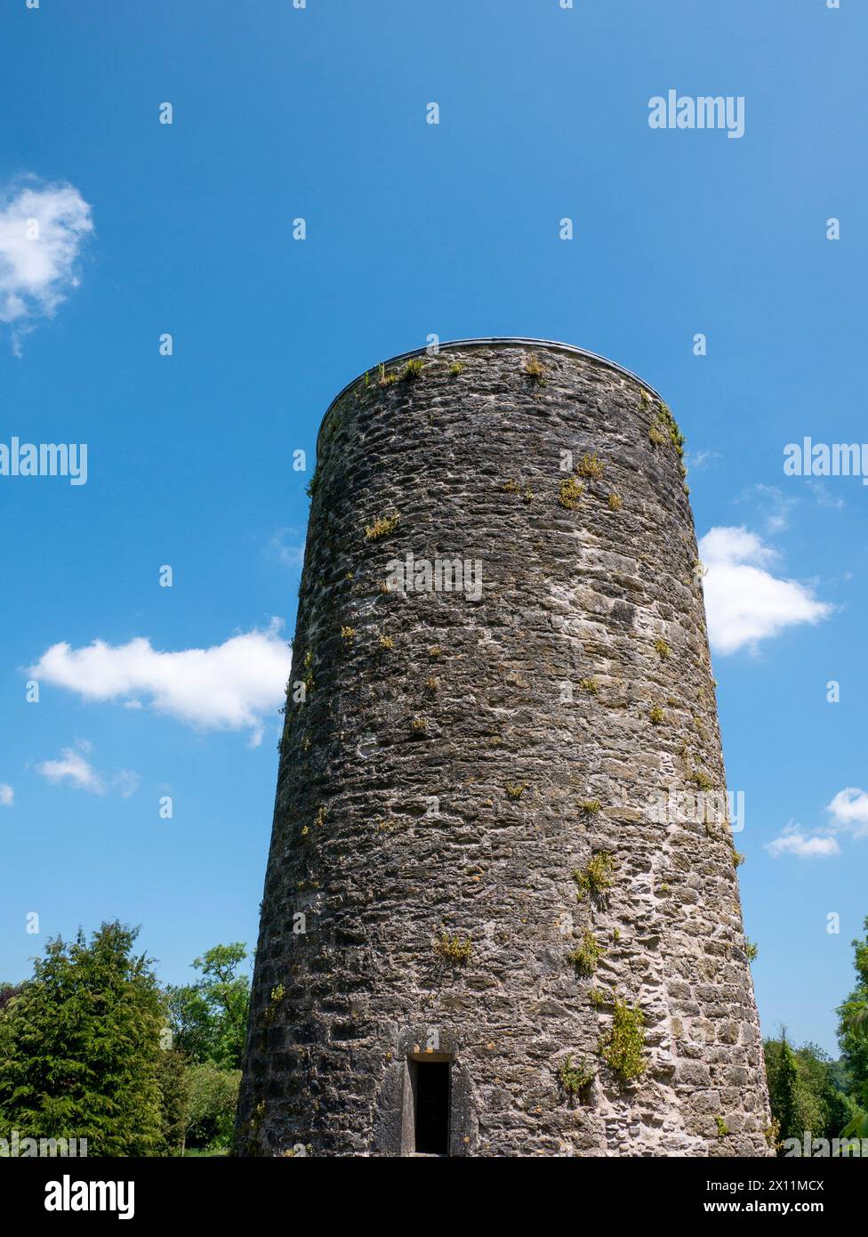 Old celtic castle tower over blue sky background, Blarney castle in ...