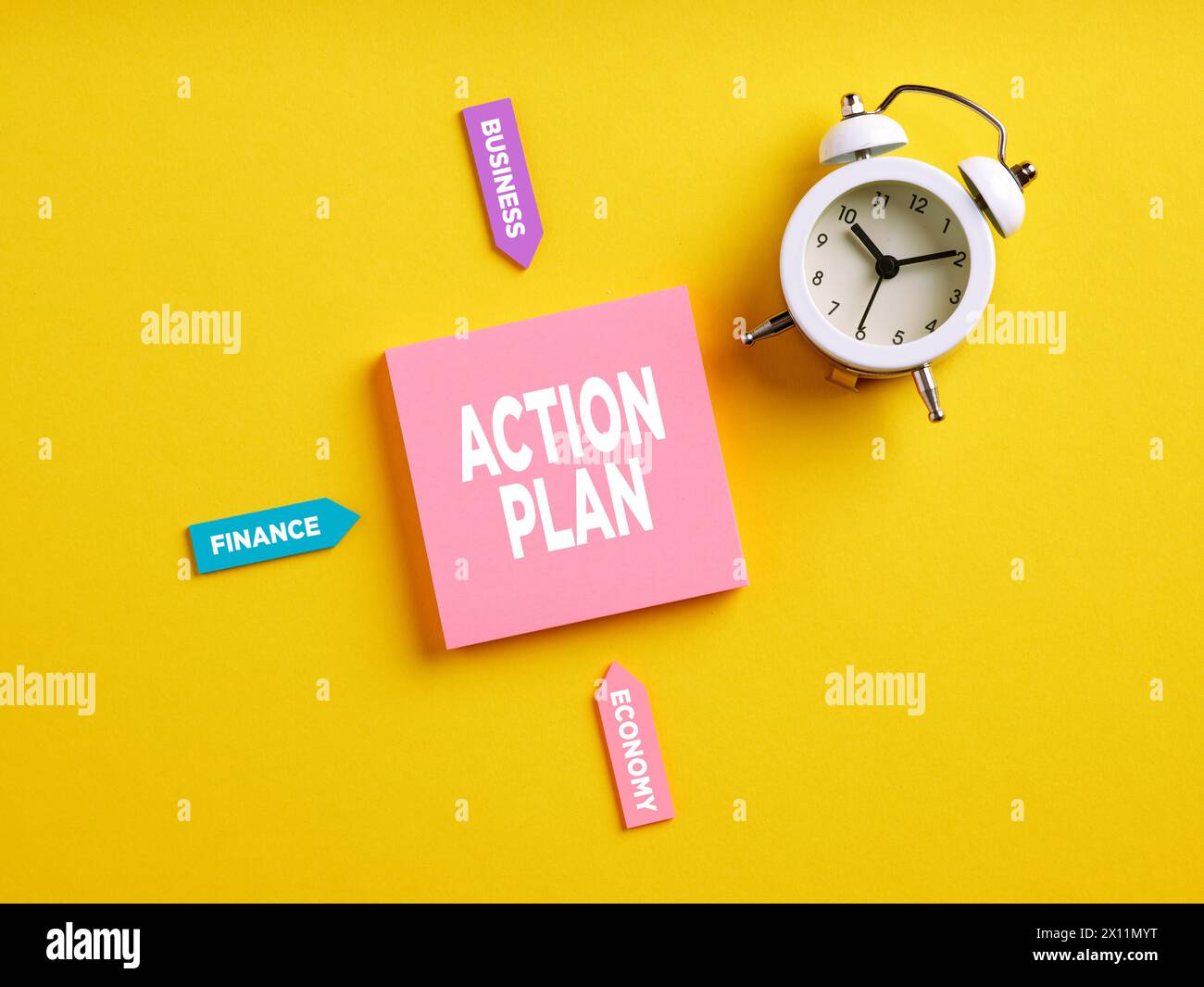 The word action plan on pink note paper. Business action plan concept ...