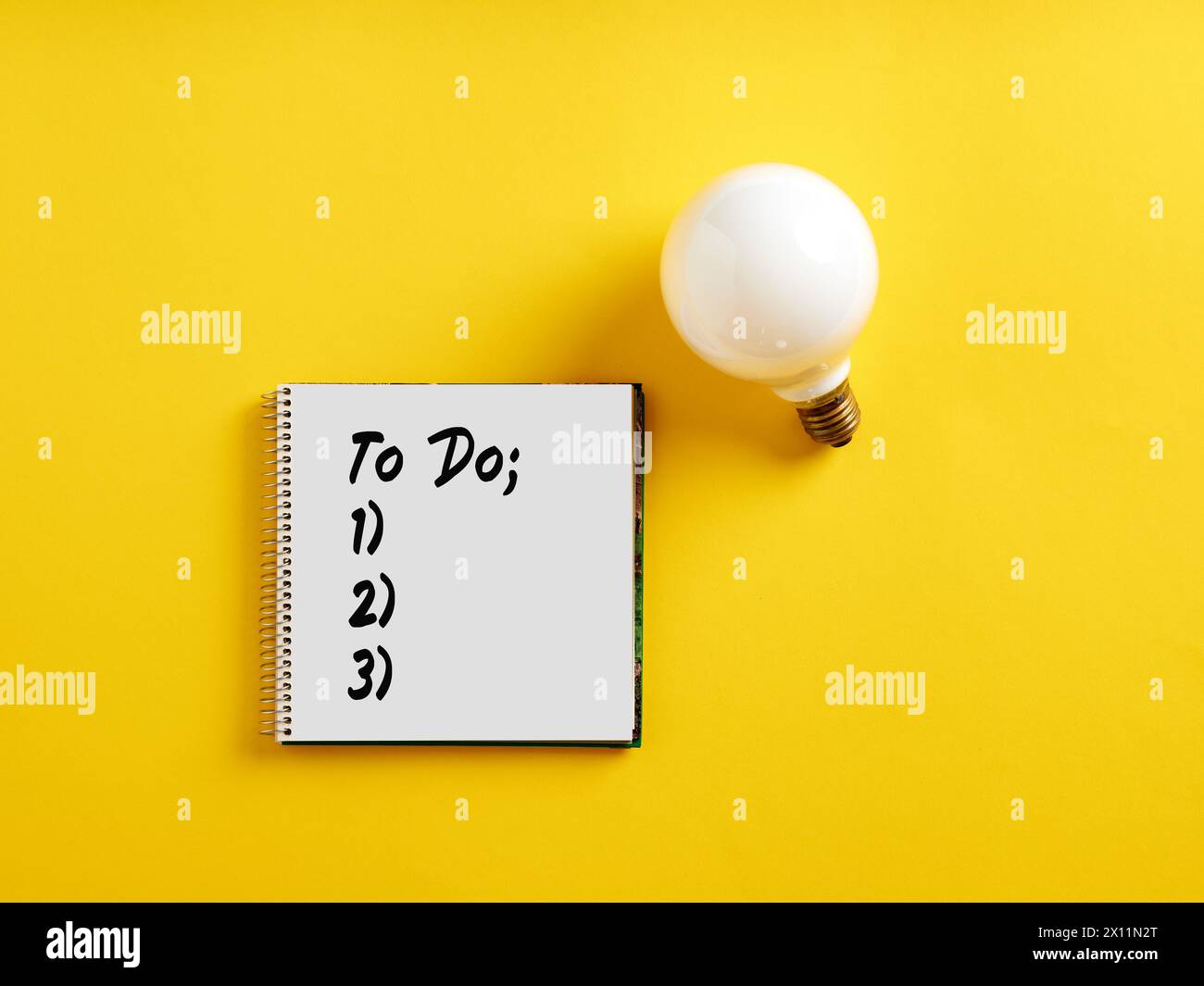 To do checklist on notepad with a light bulb. To do list, tasks to ...