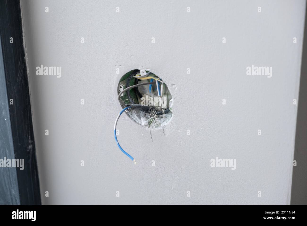 Apartment renovation. Electrical wiring. Wires sticking out of the wall ...