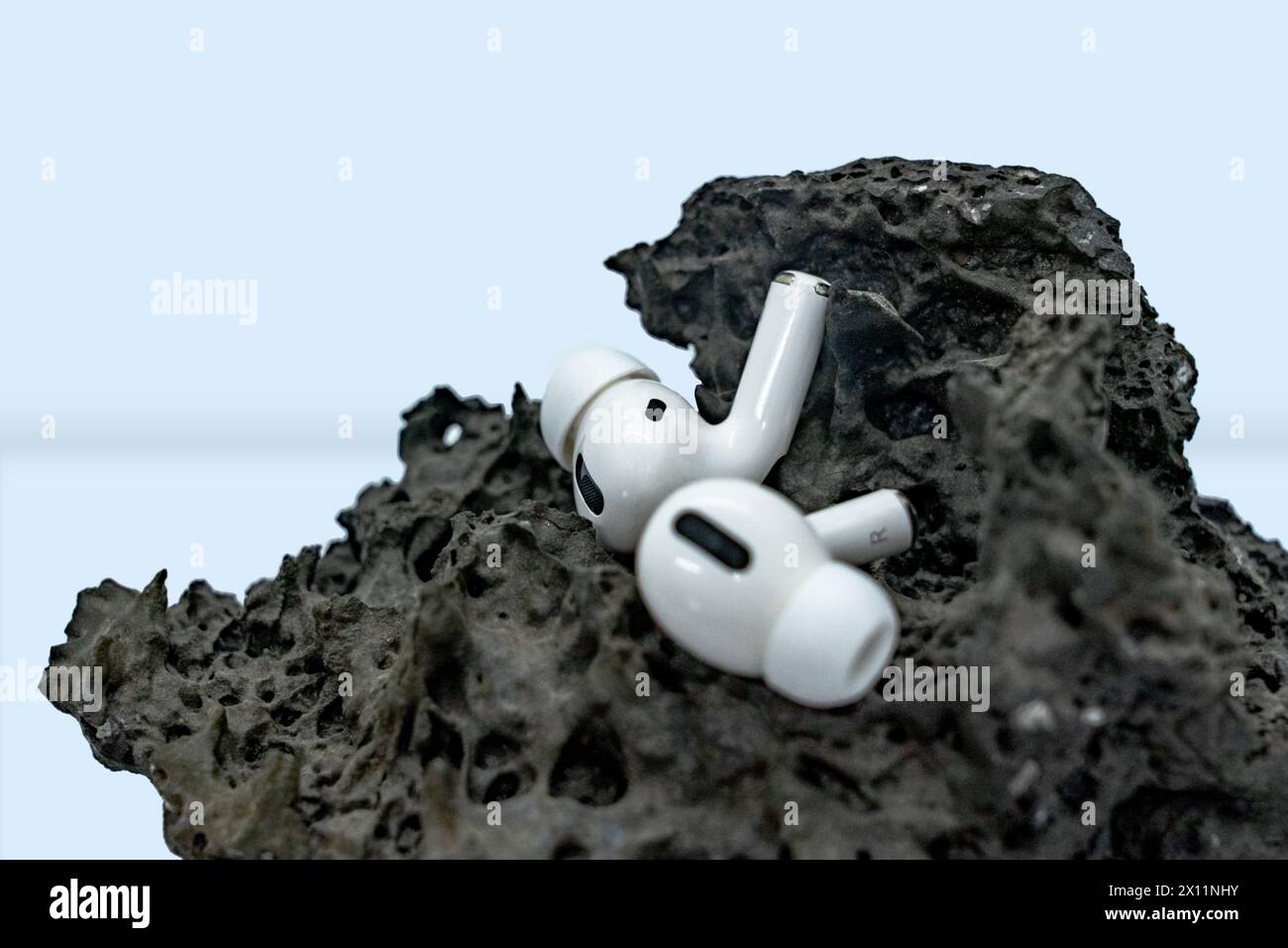 Pair of earpods placed in volcanic stone podium mockup 3D Stock Photo ...