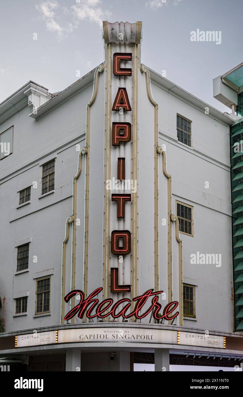 Night descends on the facade of the neon lit Capitol Theatre, Singapore ...