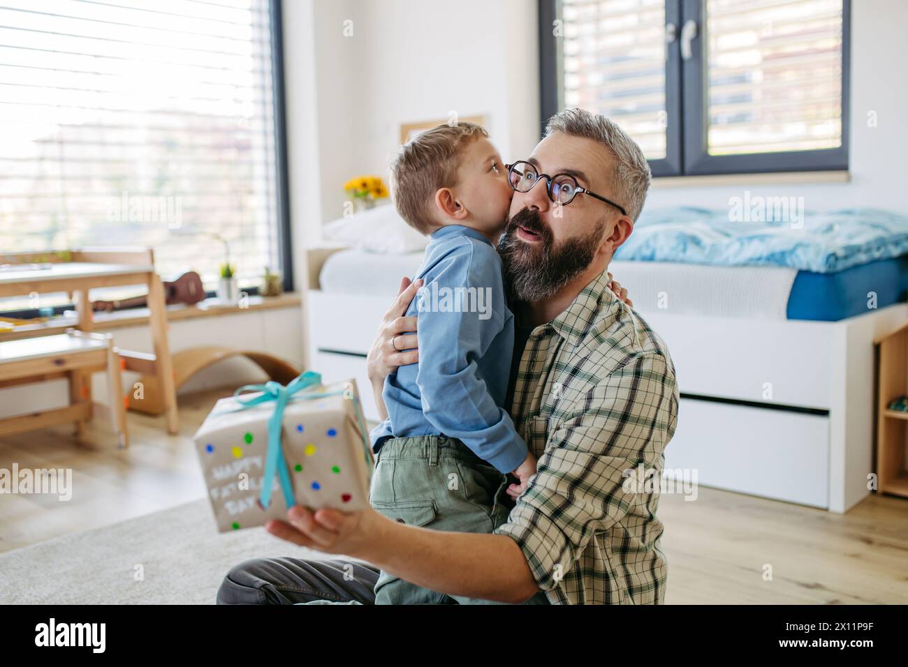 Dad get a handmade gift from little son, present wrapped in diy ...