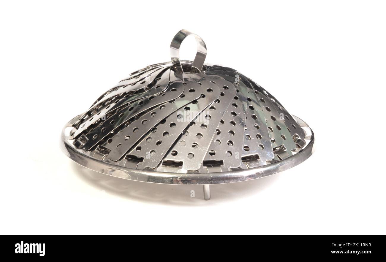 Old kitchen tool for boiling vegetables, place it in a pan with little ...