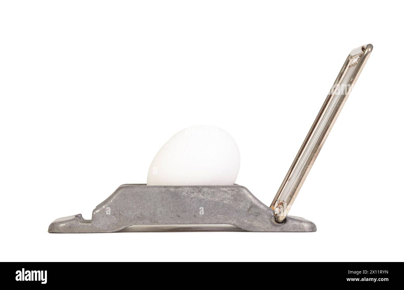 Very old egg cutter isolated on a solid background Stock Photo - Alamy