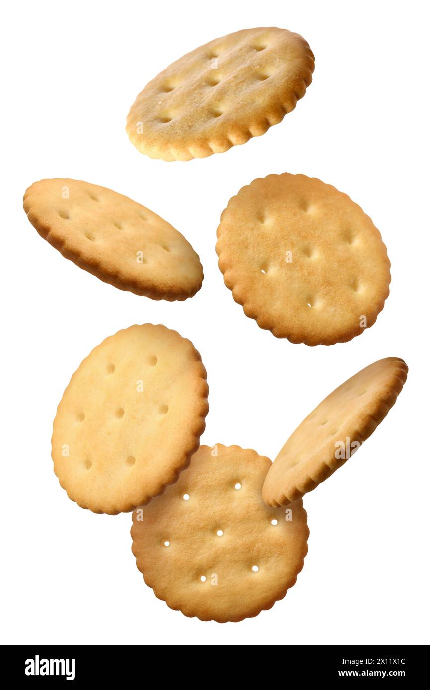 Tasty dry round crackers falling on white background Stock Photo - Alamy