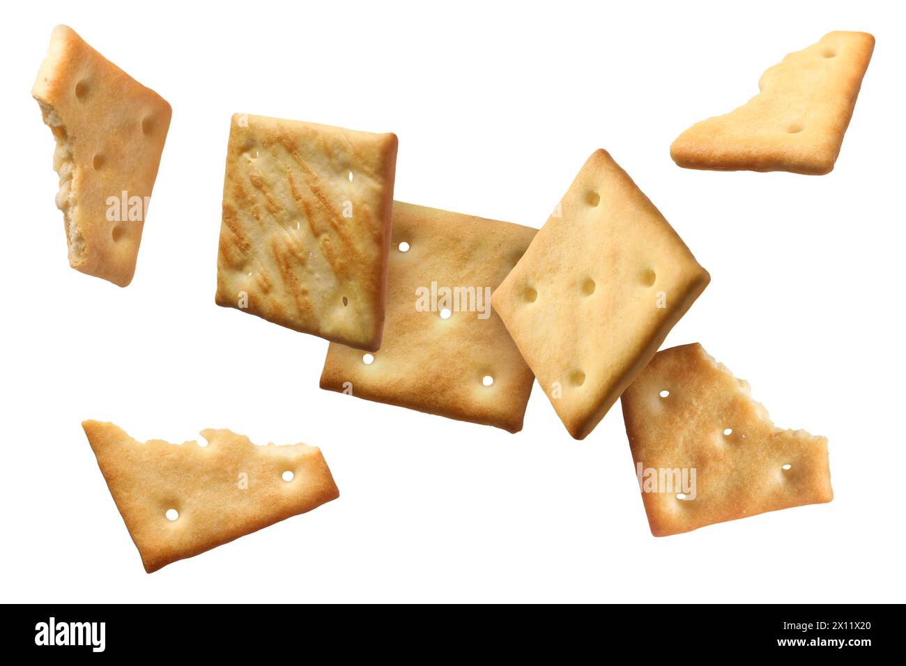 Tasty dry crackers falling on white background Stock Photo - Alamy