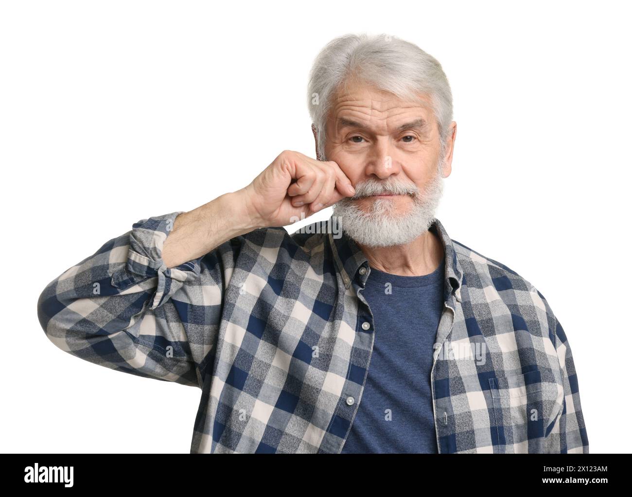 Senior man touching mustache on white background Stock Photo - Alamy