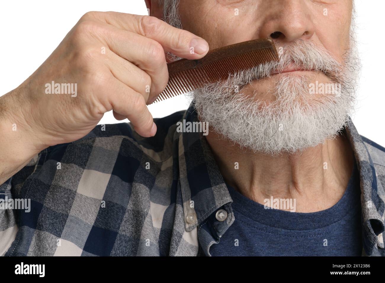 Man combing beard with comb on white background, closeup Stock Photo ...