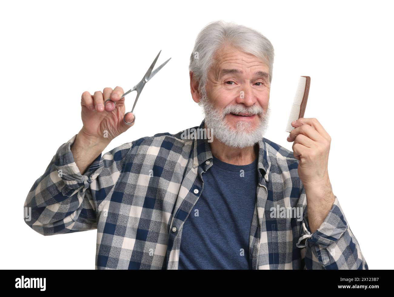 Senior man with mustache holding blade and comb on white background ...