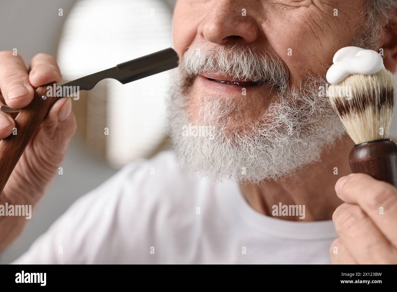 Man shaving mustache with blade in bathroom, closeup Stock Photo - Alamy