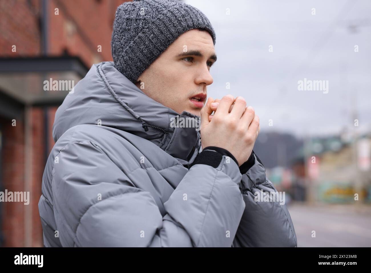 Sick man coughing on hands hi-res stock photography and images - Alamy
