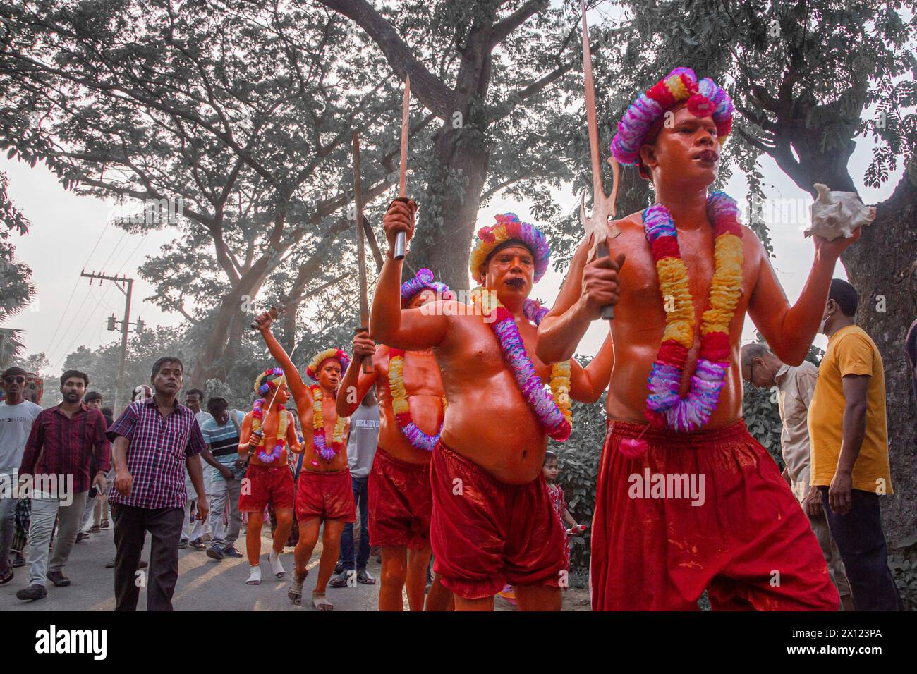 Hindu devotees dance with swords in celebration of the Lal Kach ...