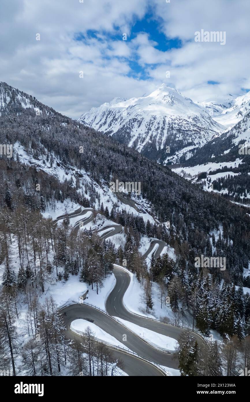 Aerial view of the Maloja Pass covered in snow. Maloja, Bregaglia ...