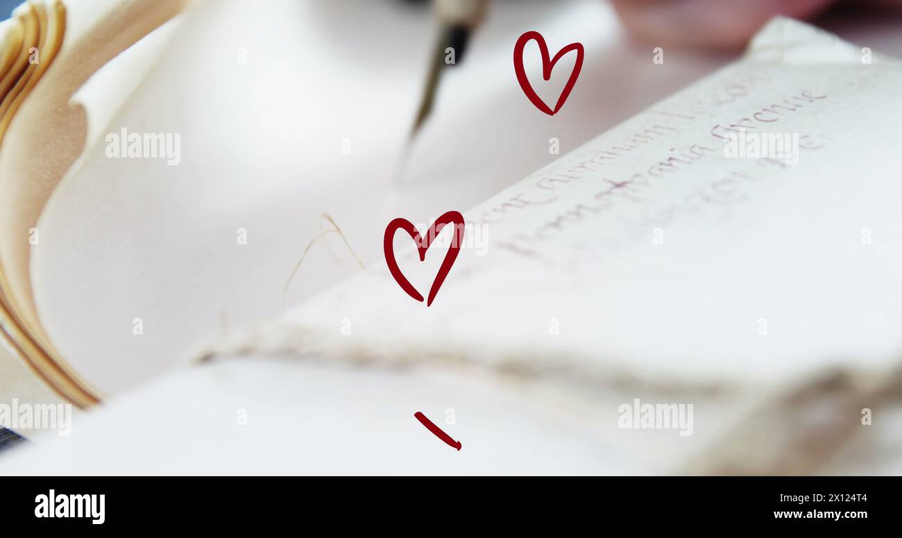 Image of hearts over hand writing in notebook Stock Photo - Alamy