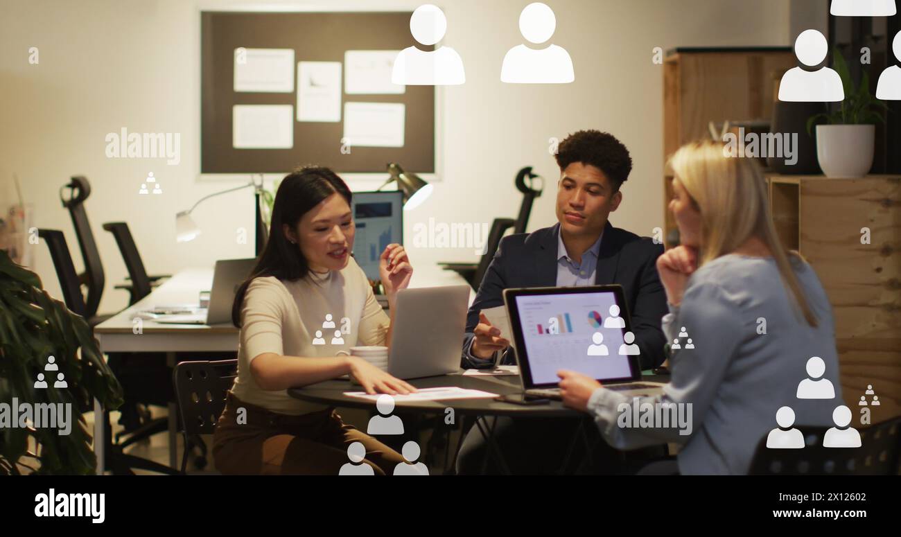 Image of social media data processing over diverse business people in ...