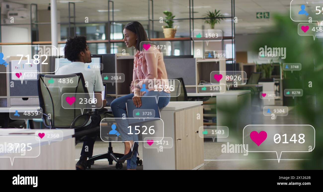 Image of notification bars over diverse coworkers discussing on desk in ...