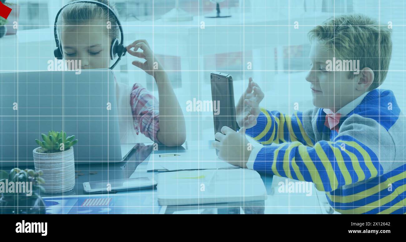 Image of falling graphs over caucasian children using laptop and ...