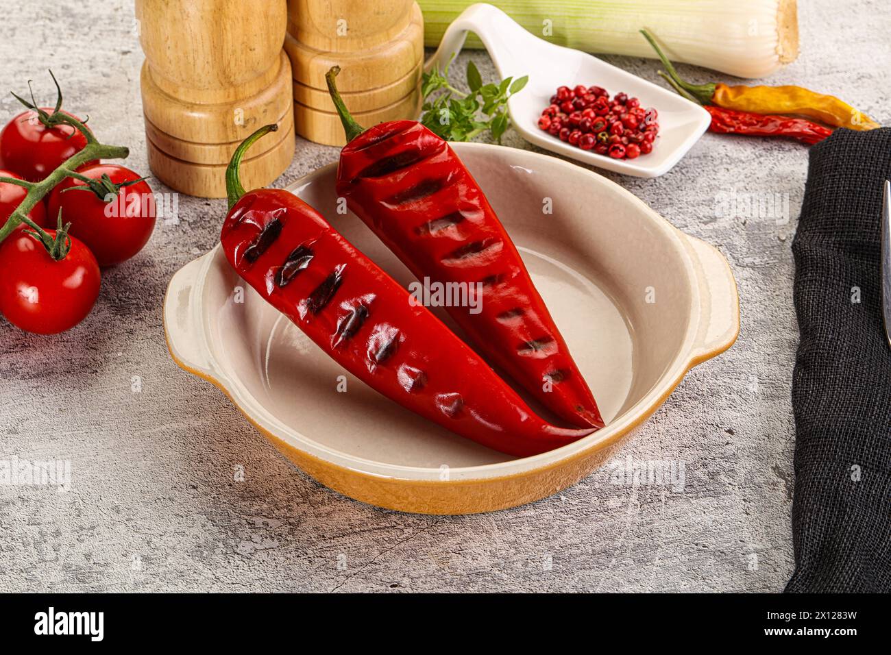 Grilled red spicy pepper snack in the bowl Stock Photo - Alamy