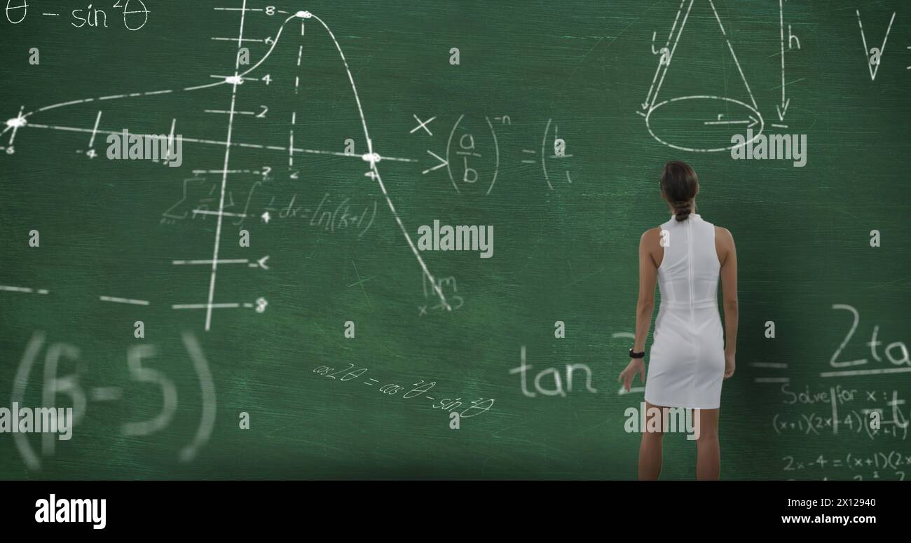 Image of a young Caucasian woman seen from behind standing and looking ...