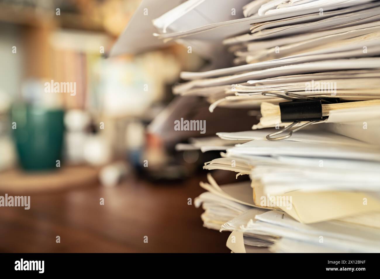 A pile of papers on working table Stock Photo - Alamy