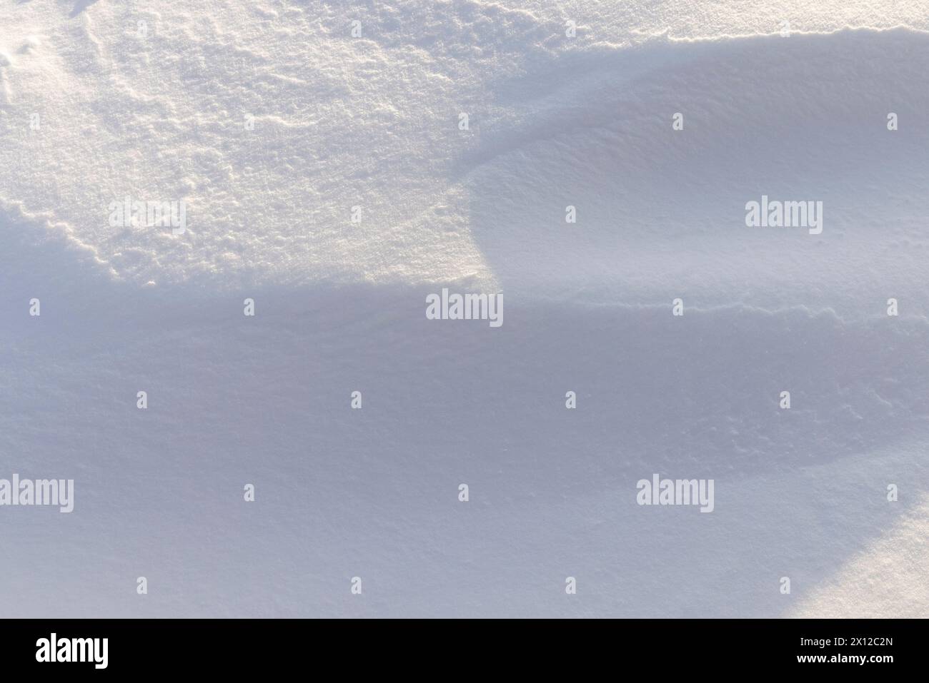 drifts of white snow in sunny weather, beautiful fresh snow after a ...