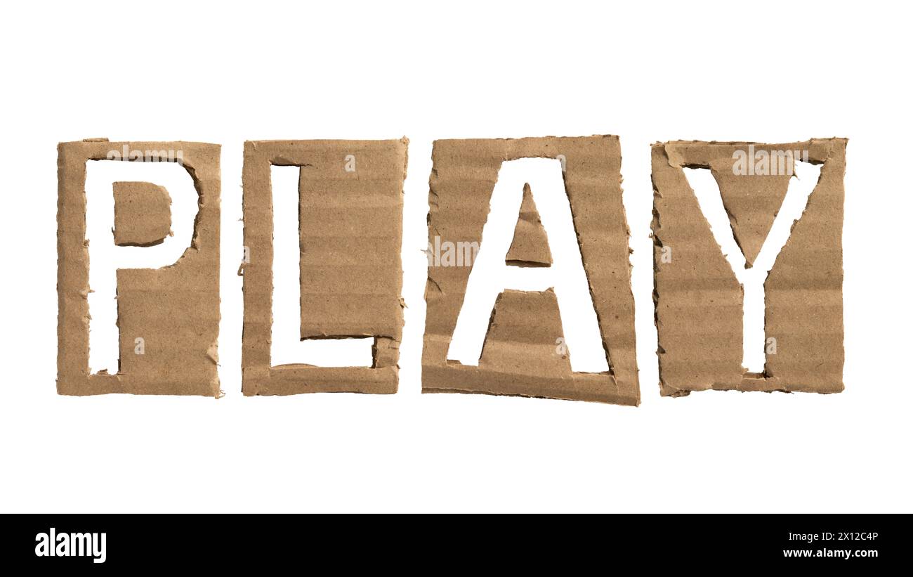 A word "PLAY" cut out from a cardboard on white background with ...