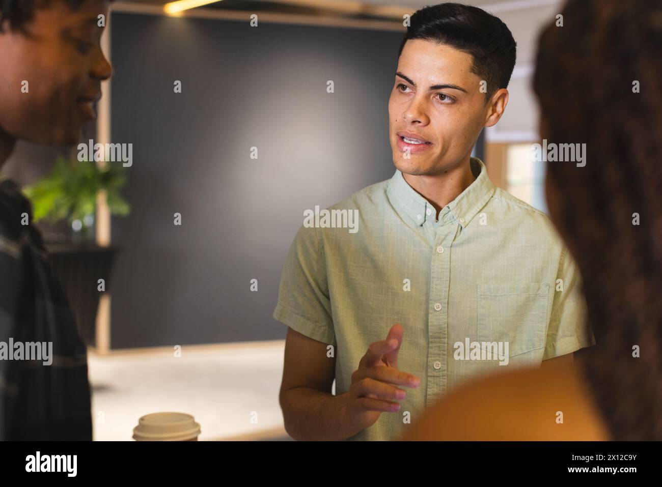 Diverse group of adults talking hi-res stock photography and images - Alamy