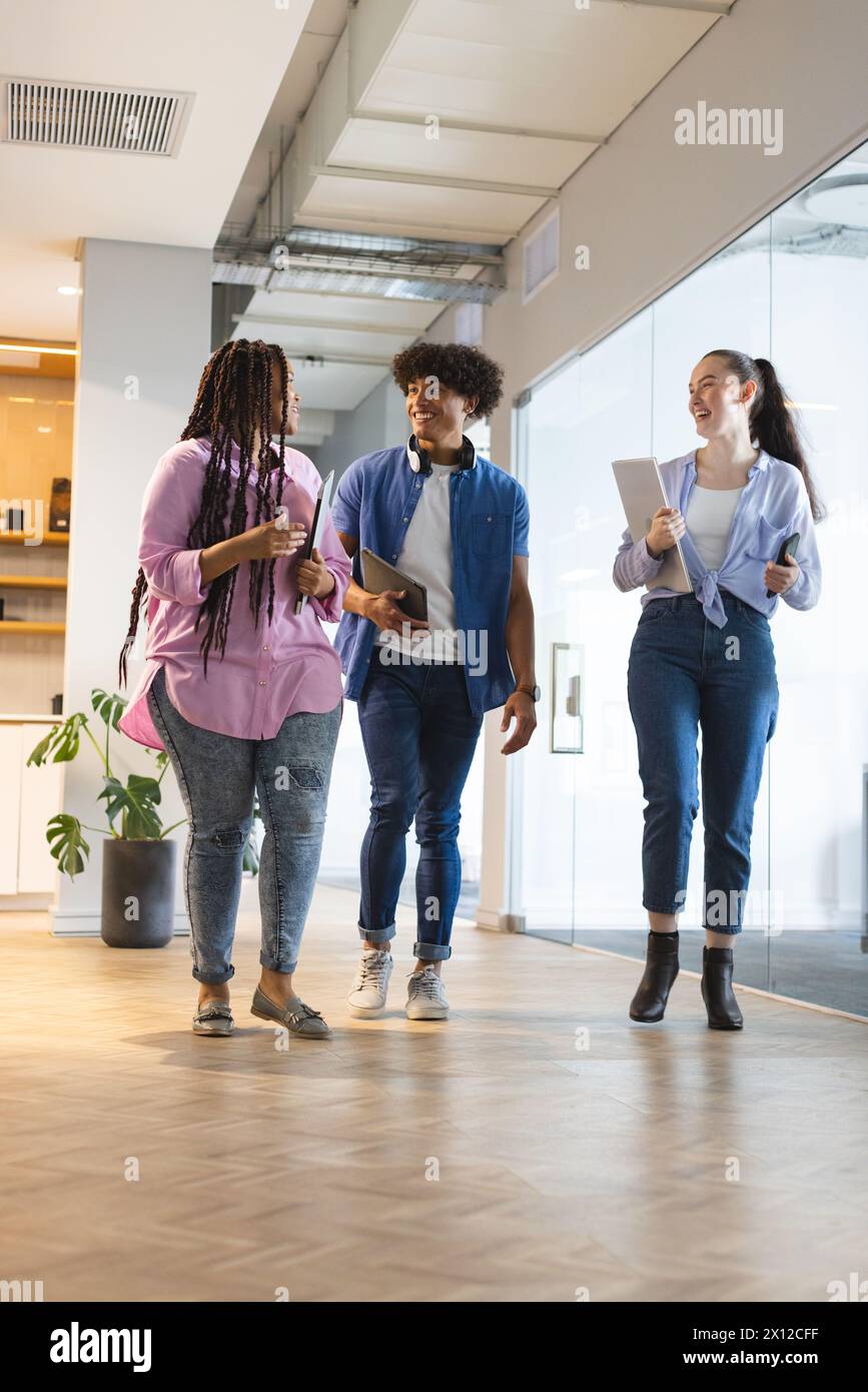 Stylish multinational couple talking in hi-res stock photography and ...
