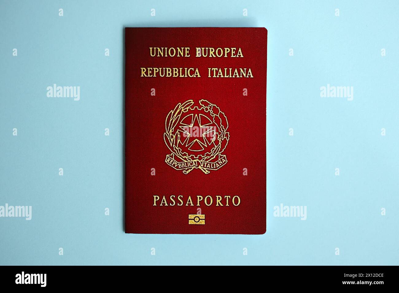 Italian passport on blue background close up. Tourism and citizenship ...