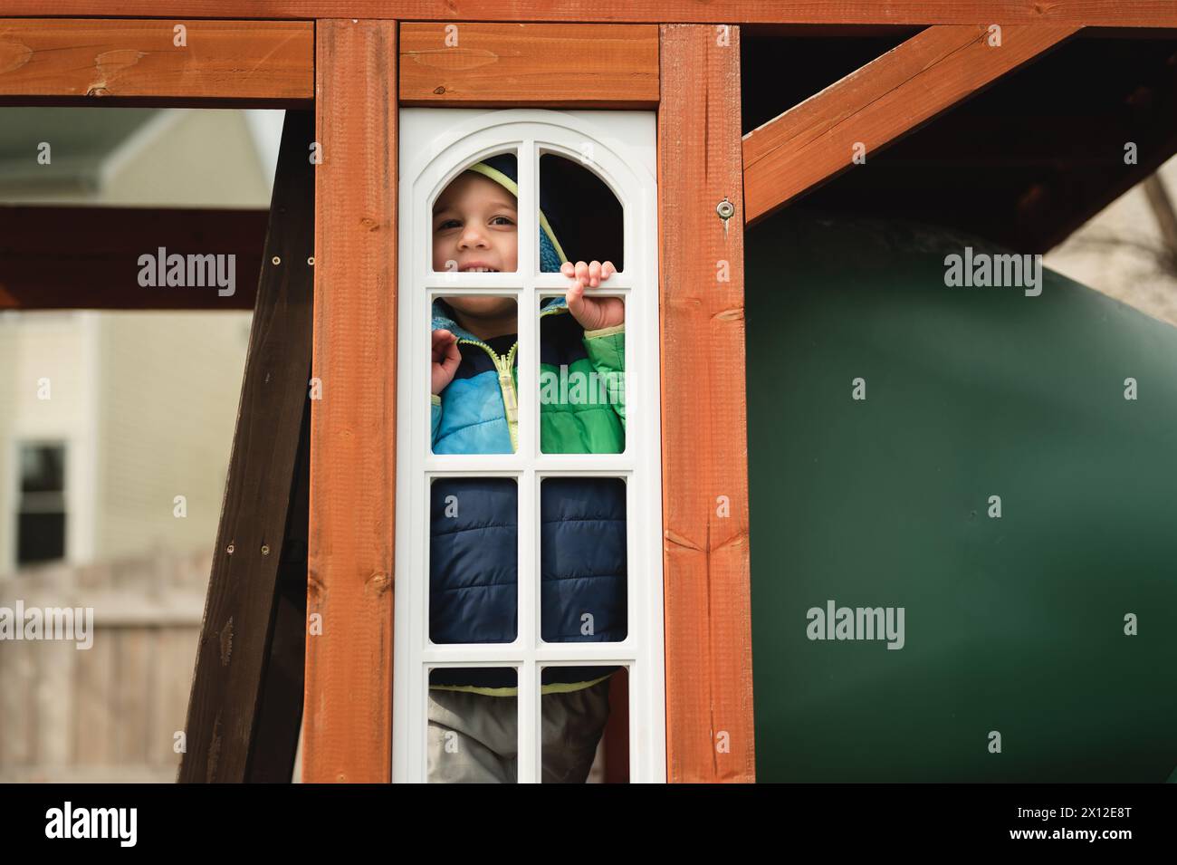 Playing boy smiling window kid cute hi-res stock photography and images ...