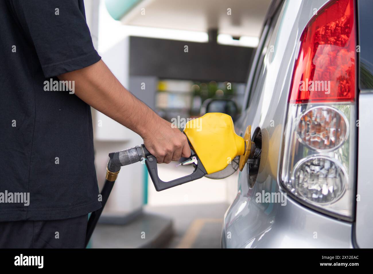 Man fuel nozzle hi-res stock photography and images - Alamy
